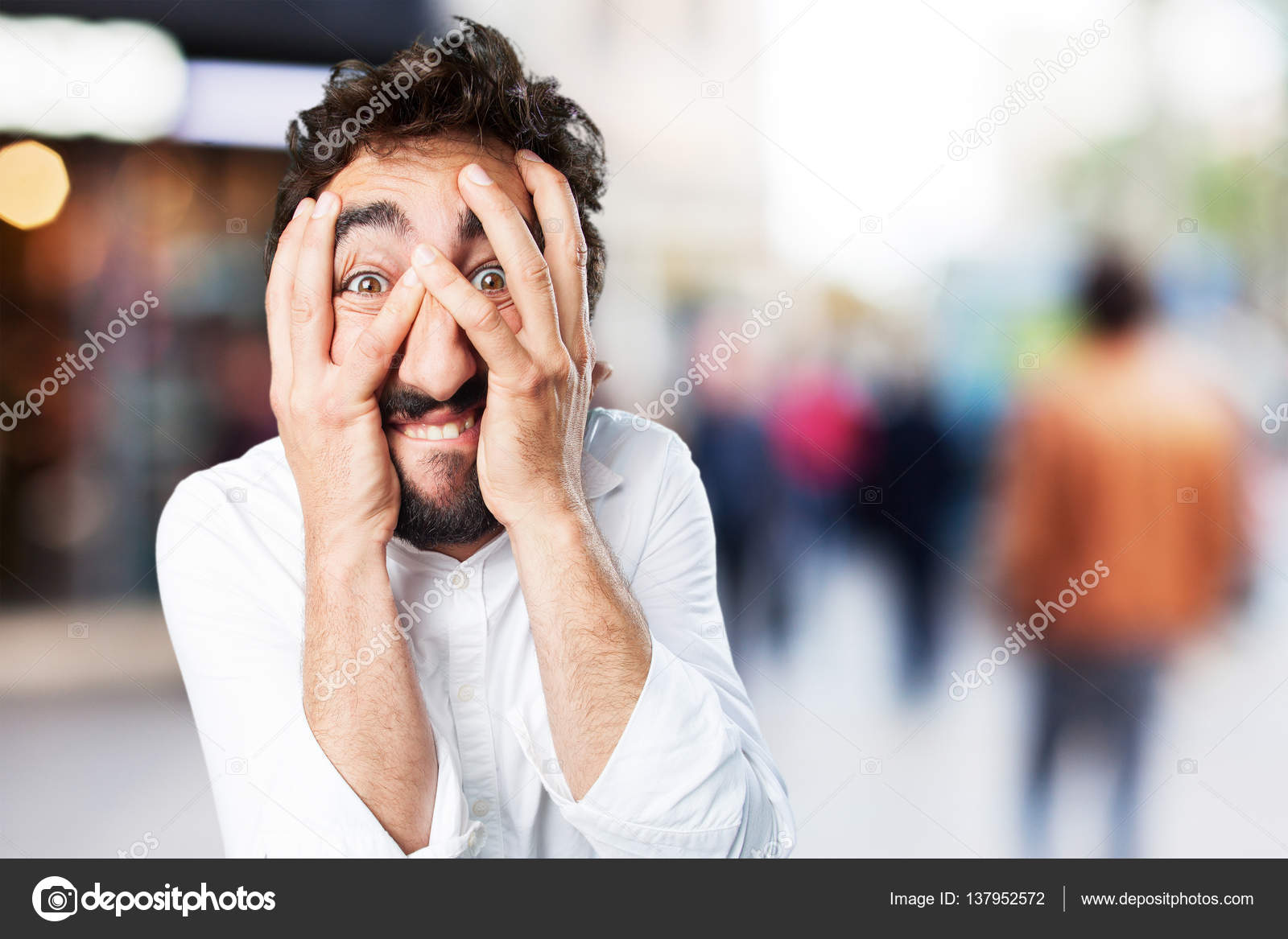 Man in scared pose with sad expression Stock Photo by ©kues 137952572