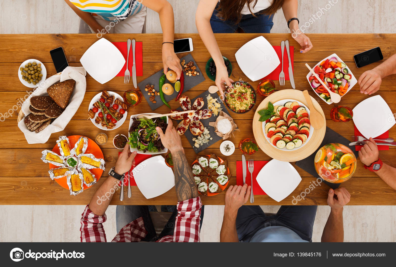 People eat healthy meals at festive table dinner party — Stock Photo ...