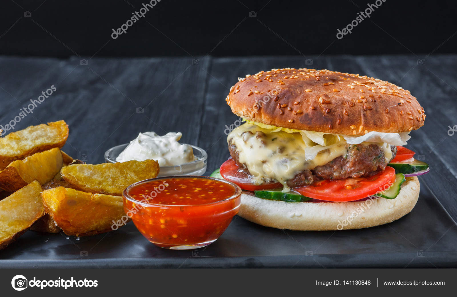 Fast food restaurant dish. Hamburger and fries wedges Stock Photo by ...