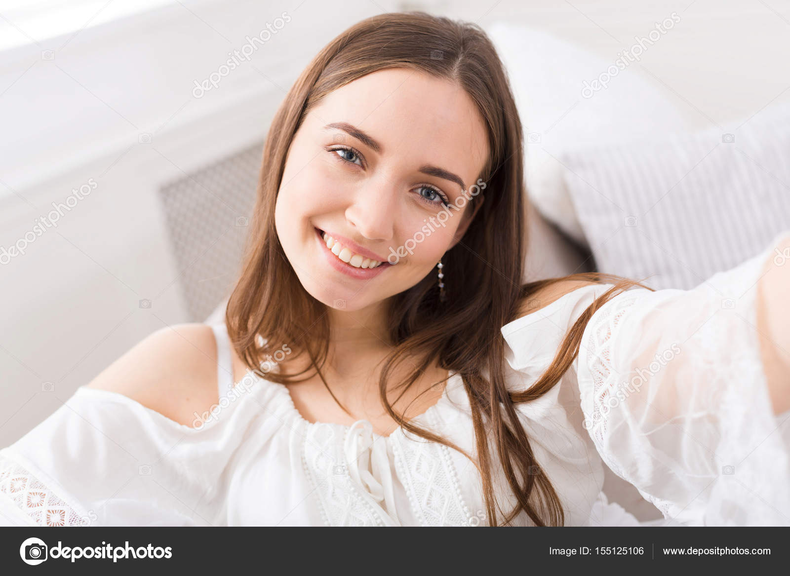 Cute smiling girl making selfie Stock Photo by ©Milkos 155125106