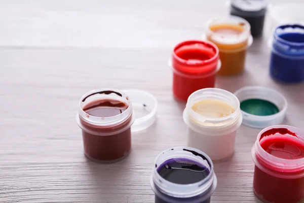 Artist workplace, set of color paints on wood desk Stock Photo by ...