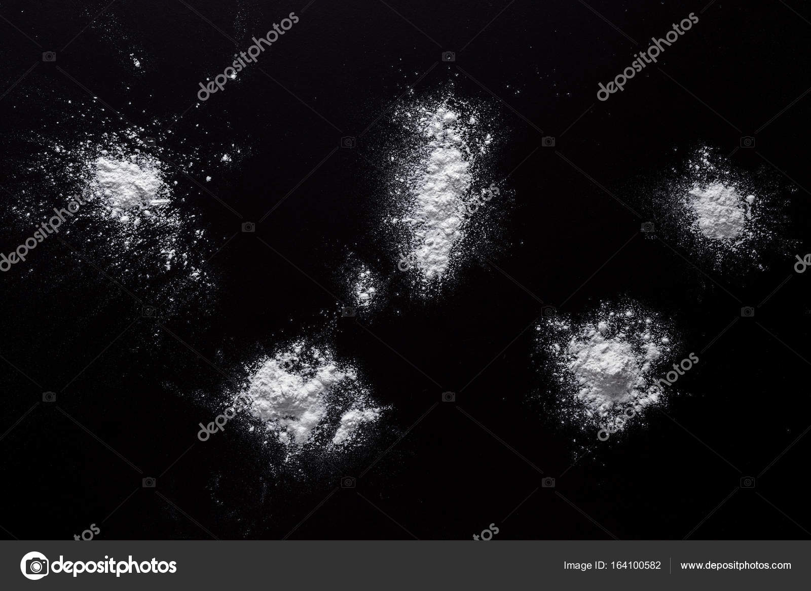 Sprinkled wheat flour splash spots on black background Stock Photo by ...