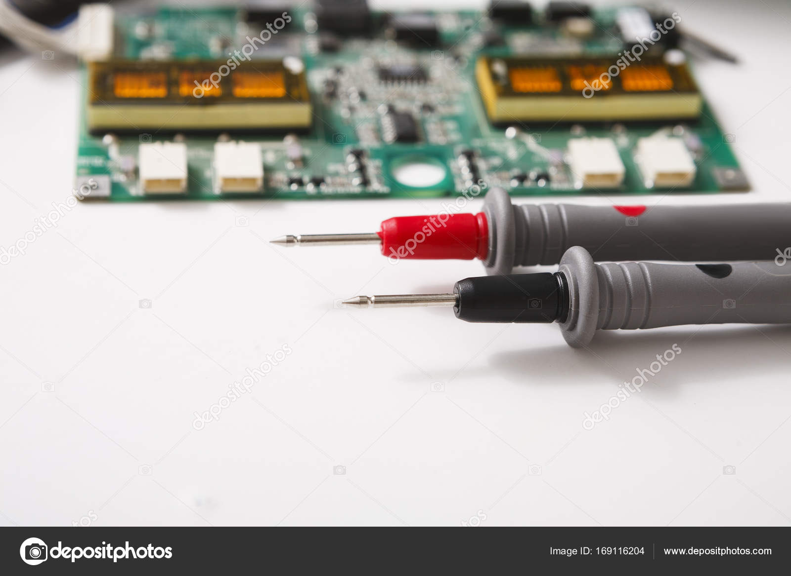 Multimeter and broken electronics at repair shop — Stock Photo © Milkos ...