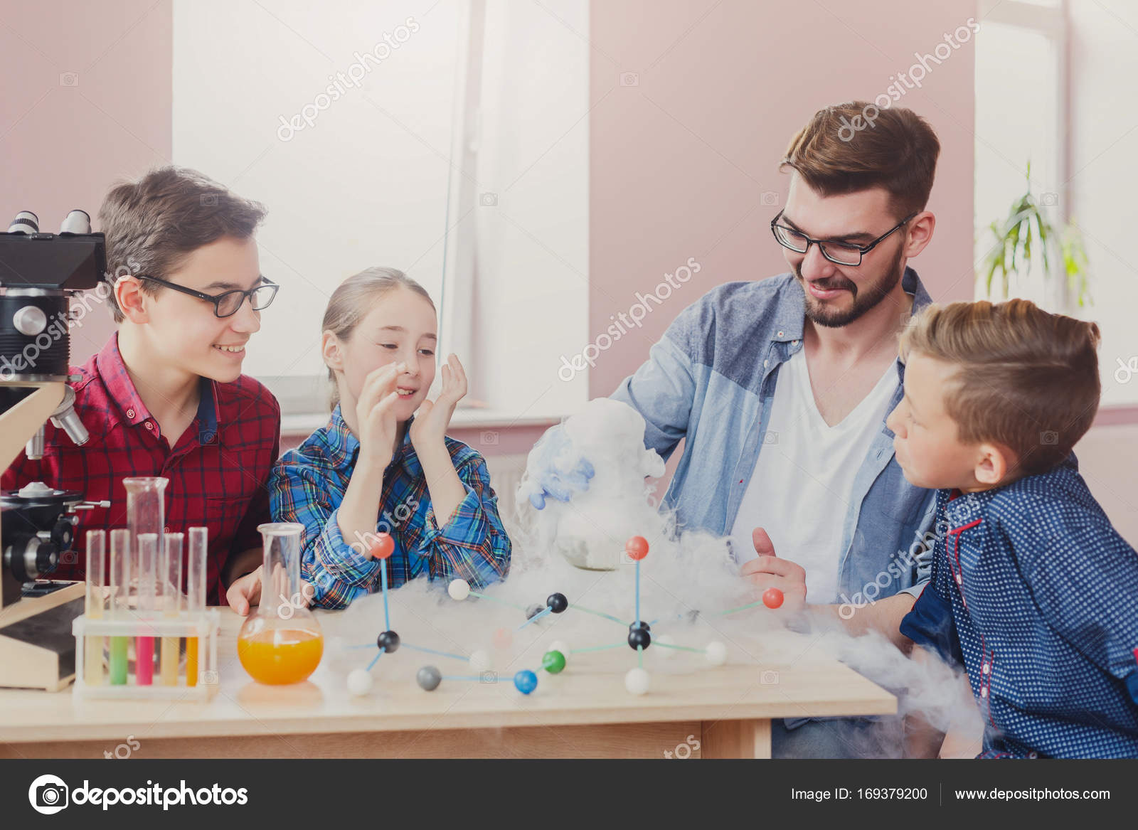 Kids doing experiment with nitrogen in laboratory Stock Photo by ...
