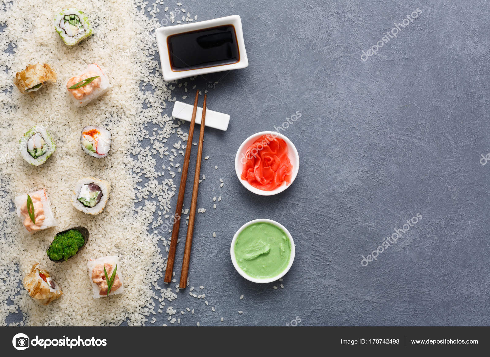Top view on set of sushi roll, maki on rustic grey and rice background ...