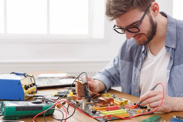 Male Engineer Testing Circuit Board — Stock Photo © IgorVetushko #184999328