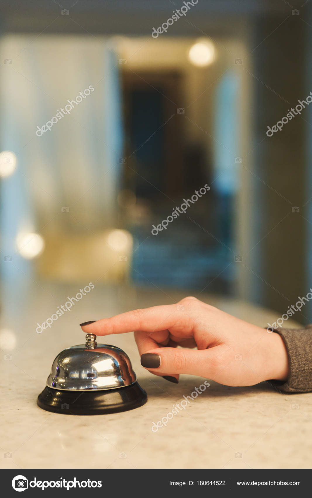 Woman ringing hotel reception service bell closeup — Stock Photo ...