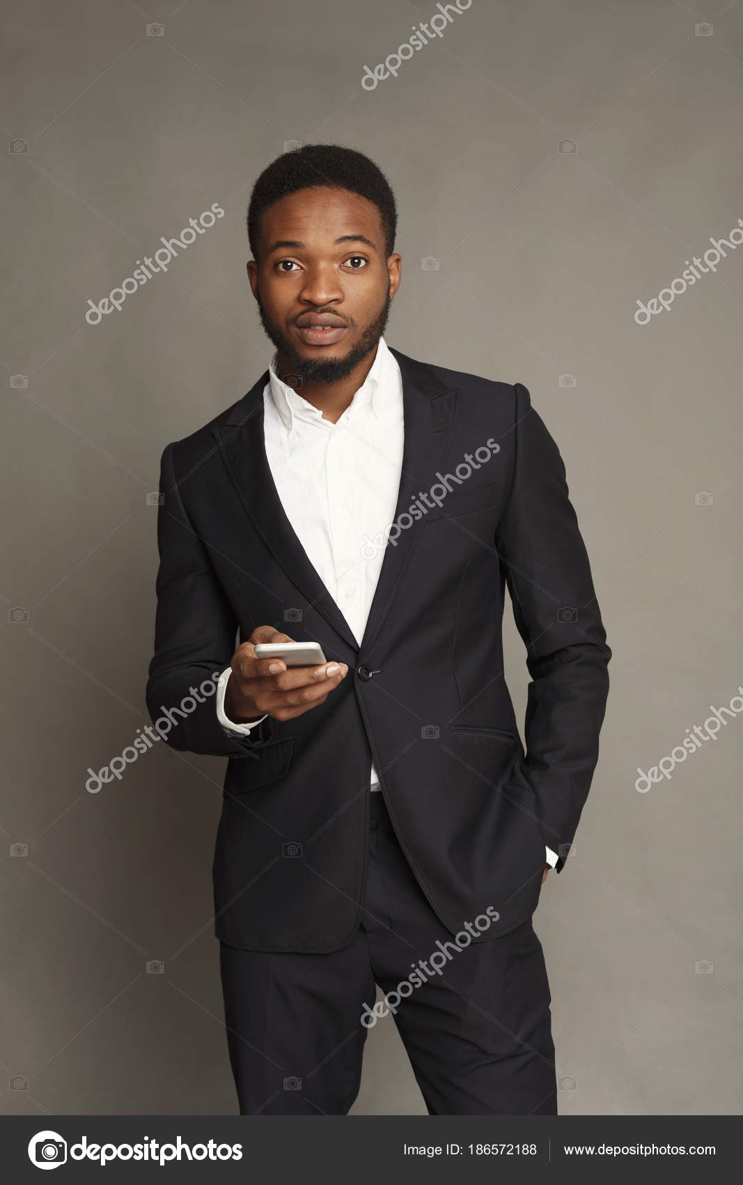Handsome young black man portrait at studio background. Stock Photo by ...