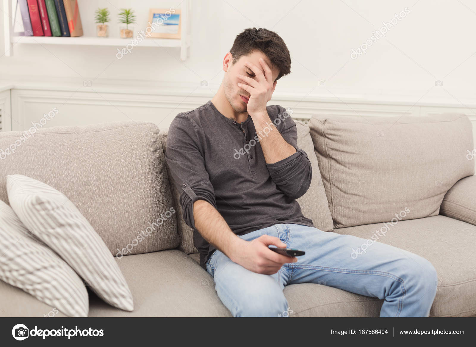 Young boring man watching television at home — Stock Photo © Milkos ...