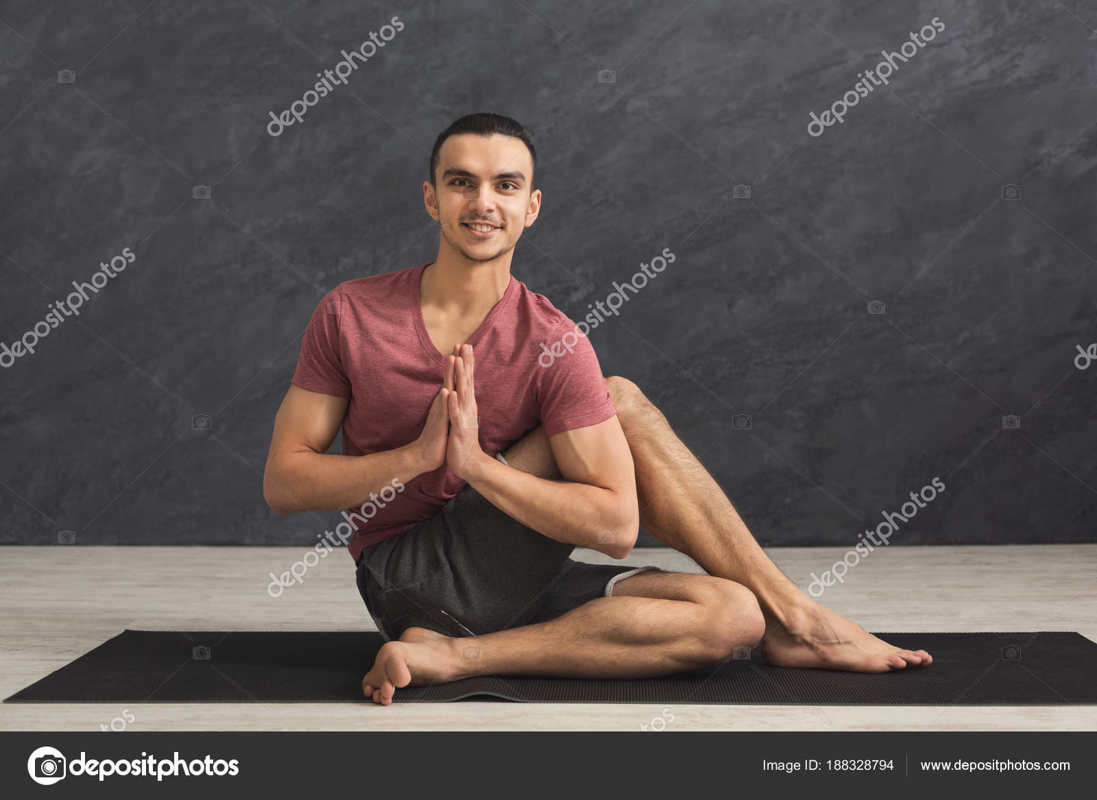 Young flexible man practicing yoga at gym — Stock Photo © Milkos #188328794