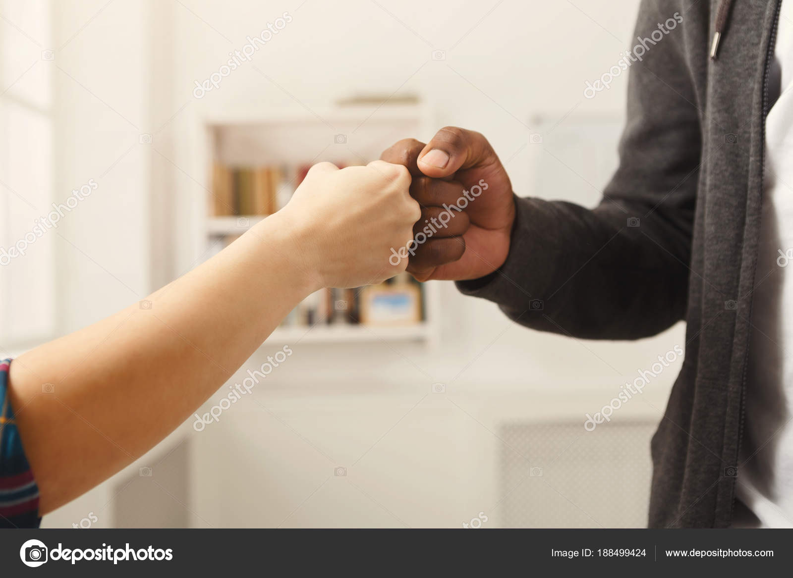 Multiethnic male and female hands putting fisfts together — Stock Photo ...