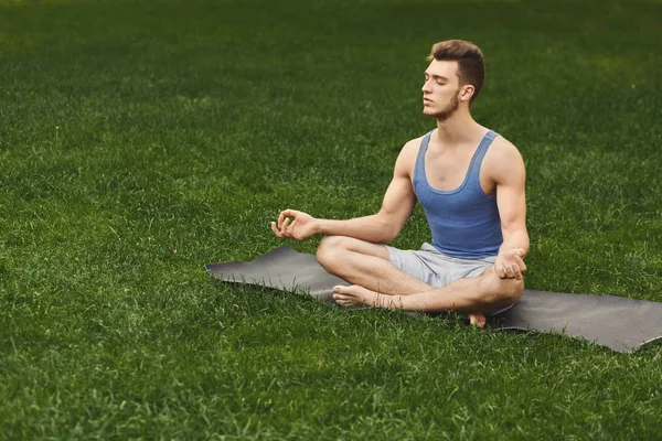 Young man practicing yoga, relax meditation pose - Stock Image - Everypixel