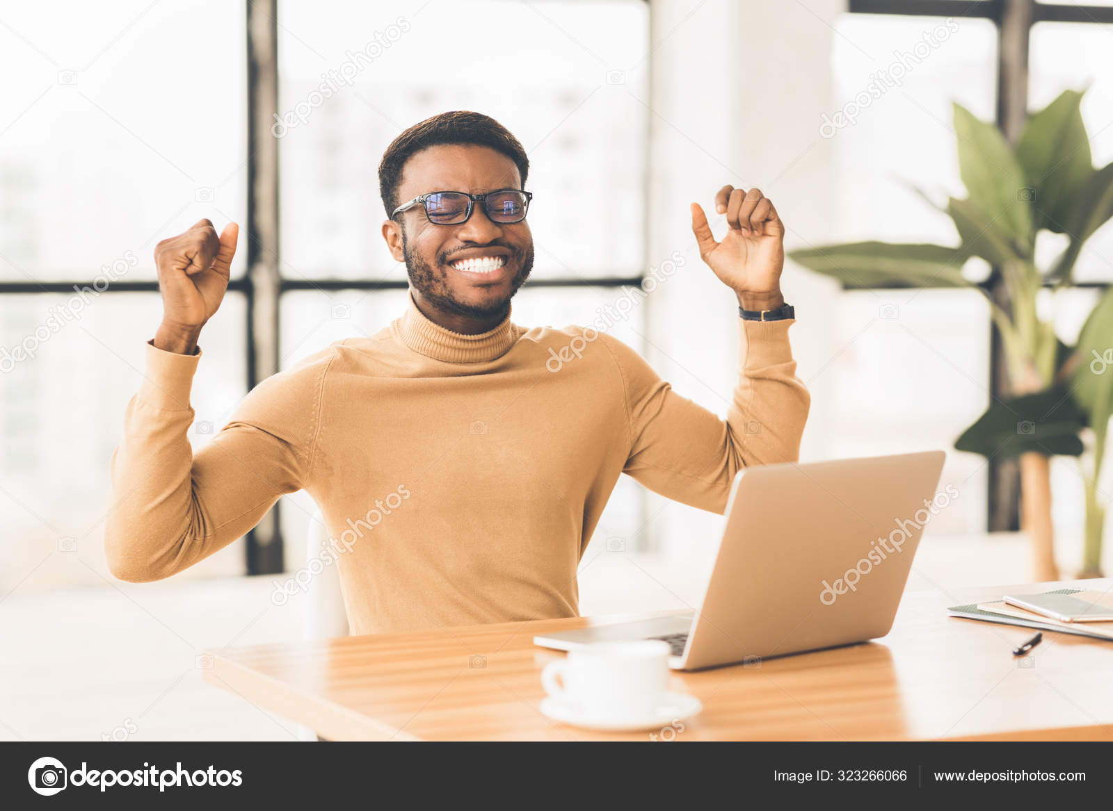 Ecstatic black guy celebrating his success at work — Stock Photo ...