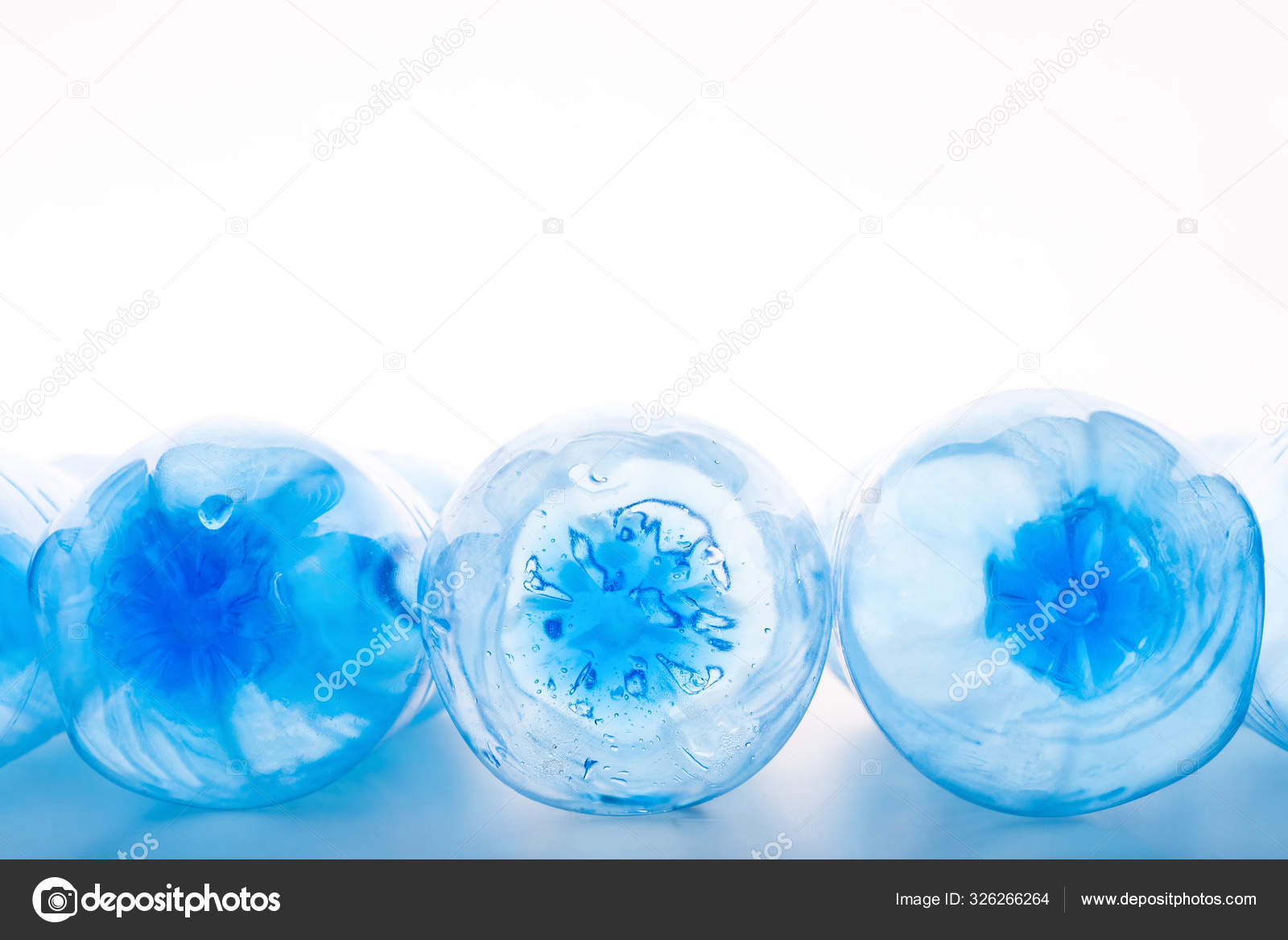 Top view of plastic bottles bottoms on white background Stock Photo by ...