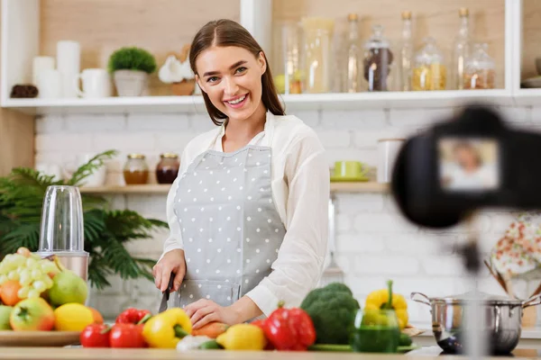 Food blogger concept. Happy woman recording video on camera - Stock ...