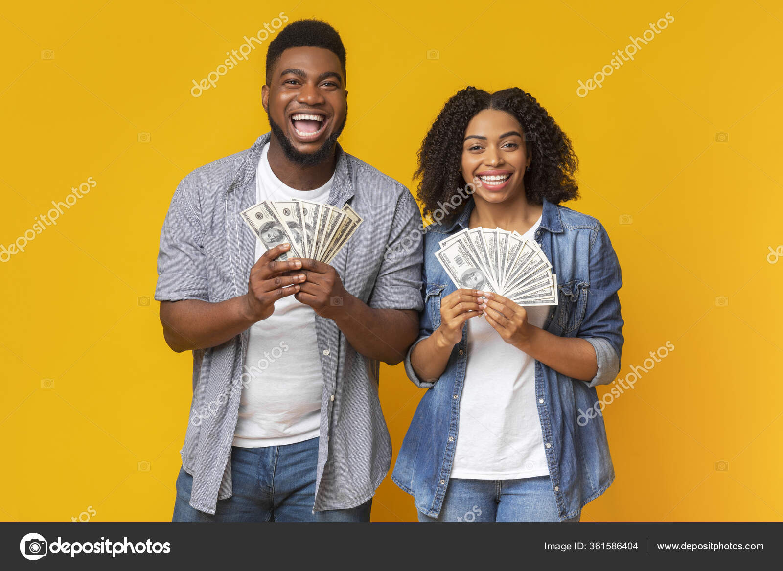 Happy millennial couple posing with lot of money, holding with dollar ...