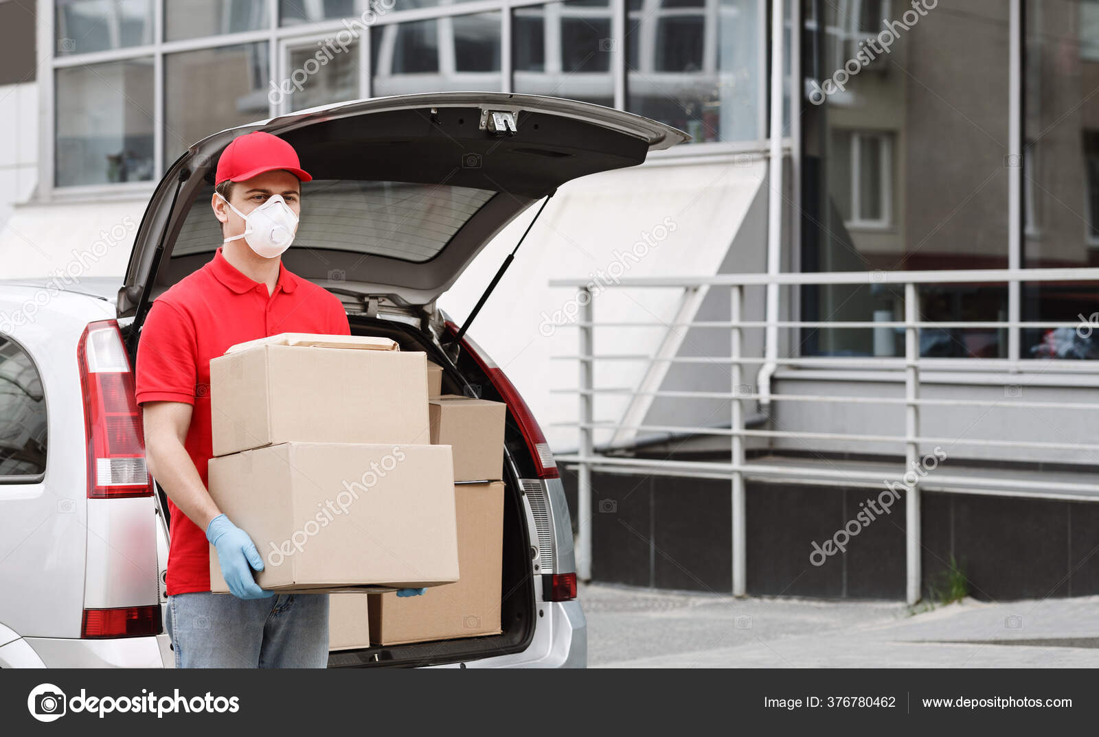 Home delivery during panic of coronavirus concept. Courier with boxes ...