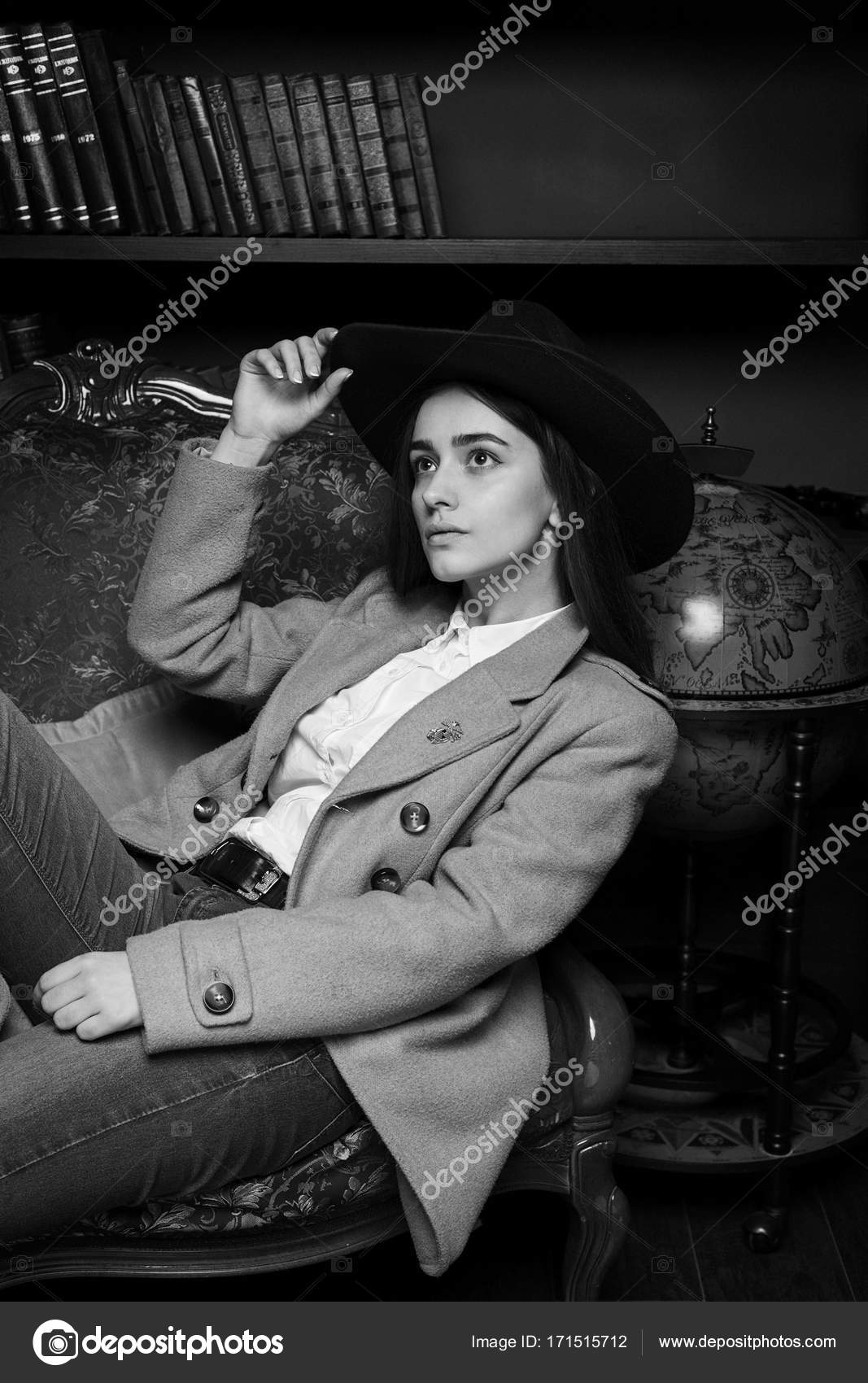 Woman sitting in vintage armchair Stock Photo by ©smmartynenko 171515712