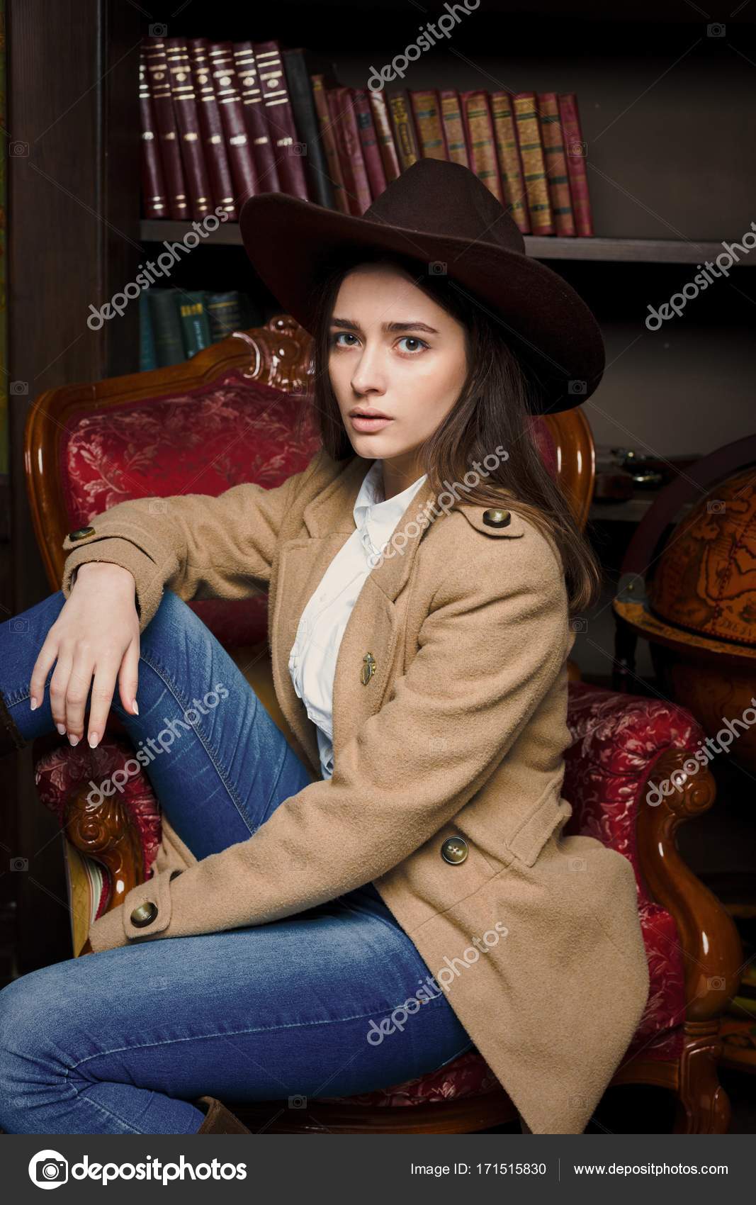 Woman sitting in vintage armchair Stock Photo by ©smmartynenko 171515830