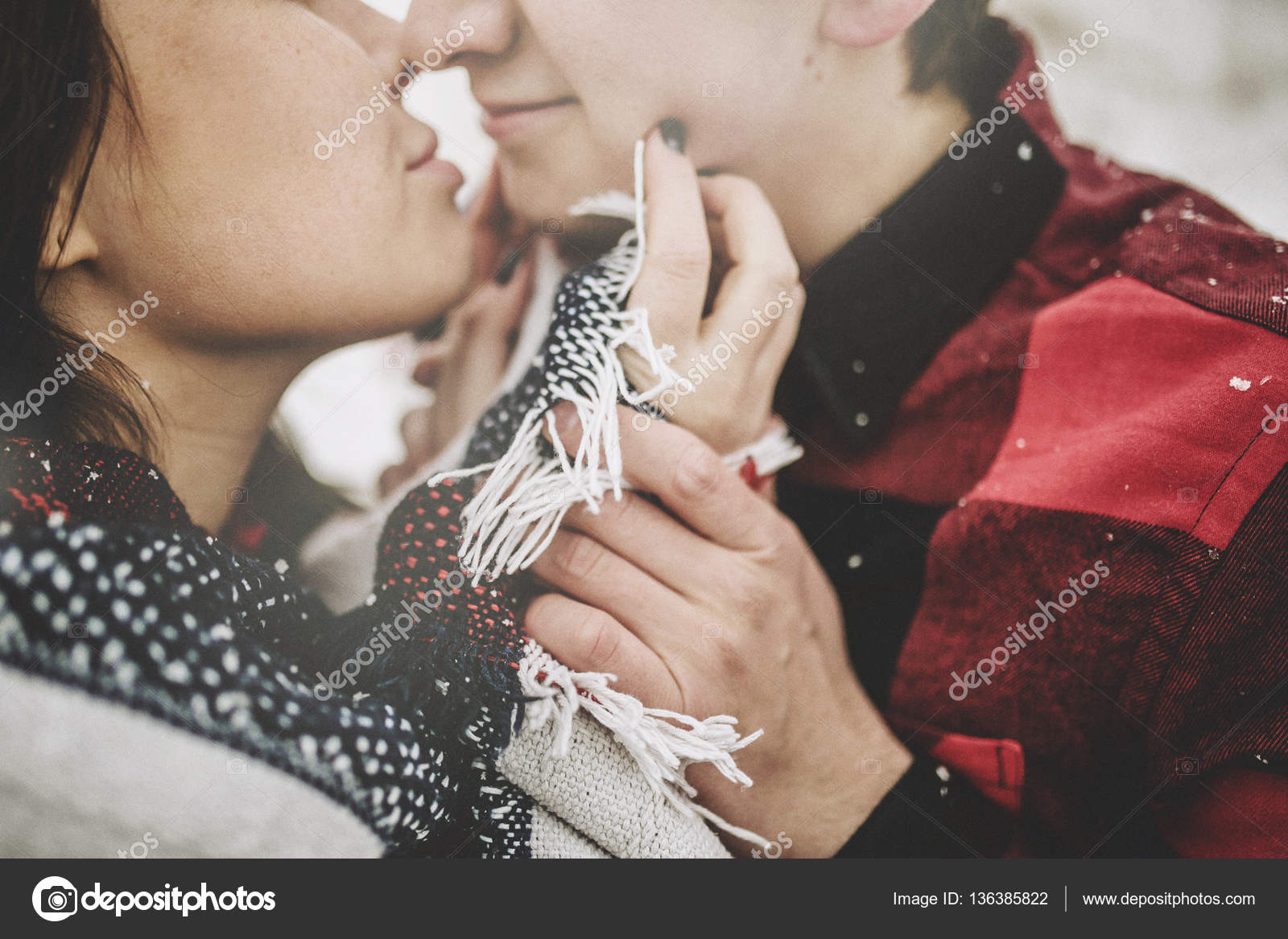 Cuddling lovers wrapped in blanket — Stock Photo © KristinaPonomareva ...
