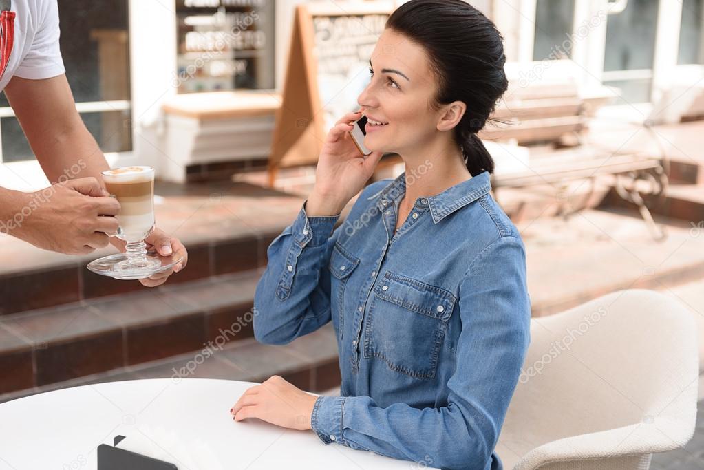 Beautiful woman spending time in coffee shop Stock Photo by ...