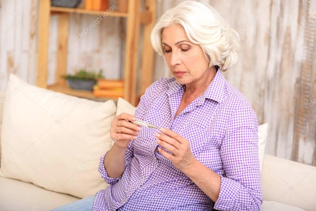 Mature lady has problems with health Stock Photo by ©iakovenko123 129710844