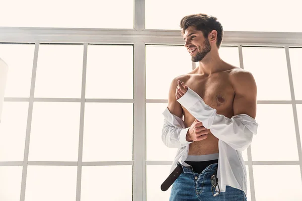 Man taking off shirt Stock Photos, Royalty Free Man taking off shirt ...