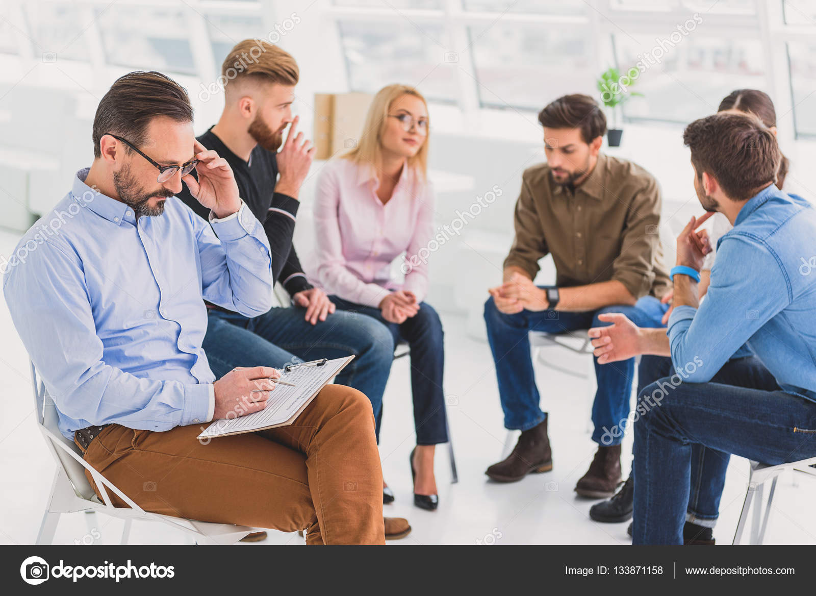 Concentrated psychologist reading personal profile — Stock Photo ...
