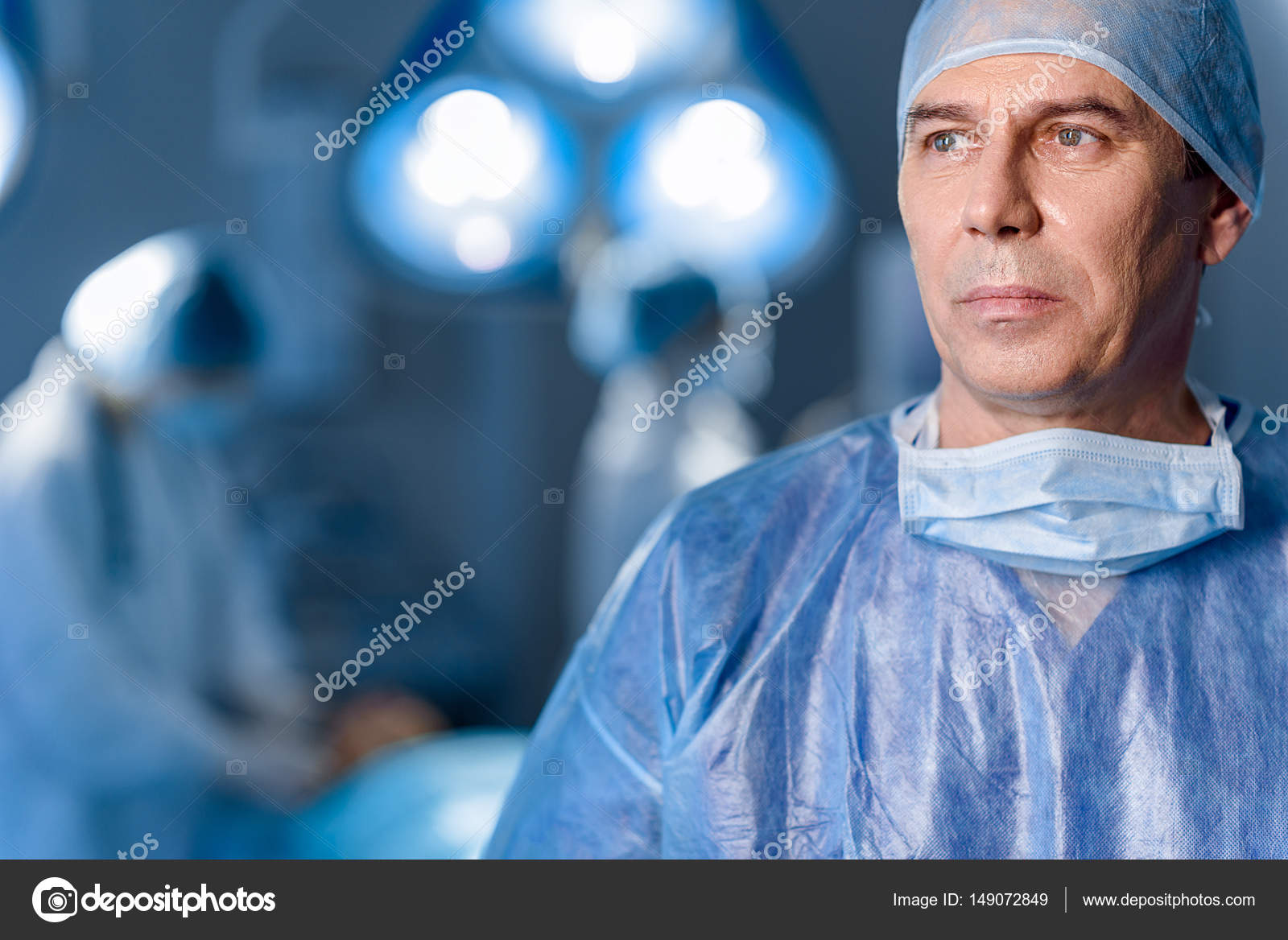 Sad doctor in protective uniform Stock Photo by ©iakovenko123 149072849