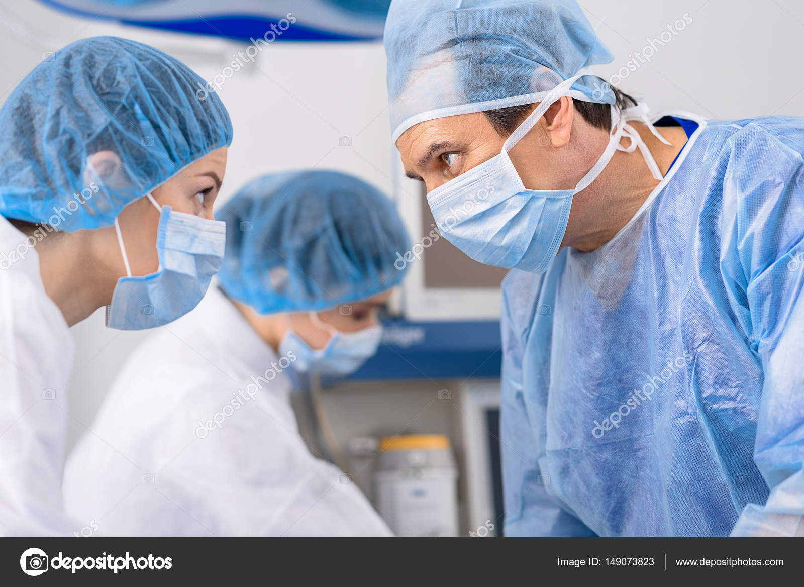 Attentive doctors doing their job Stock Photo by ©iakovenko123 149073823