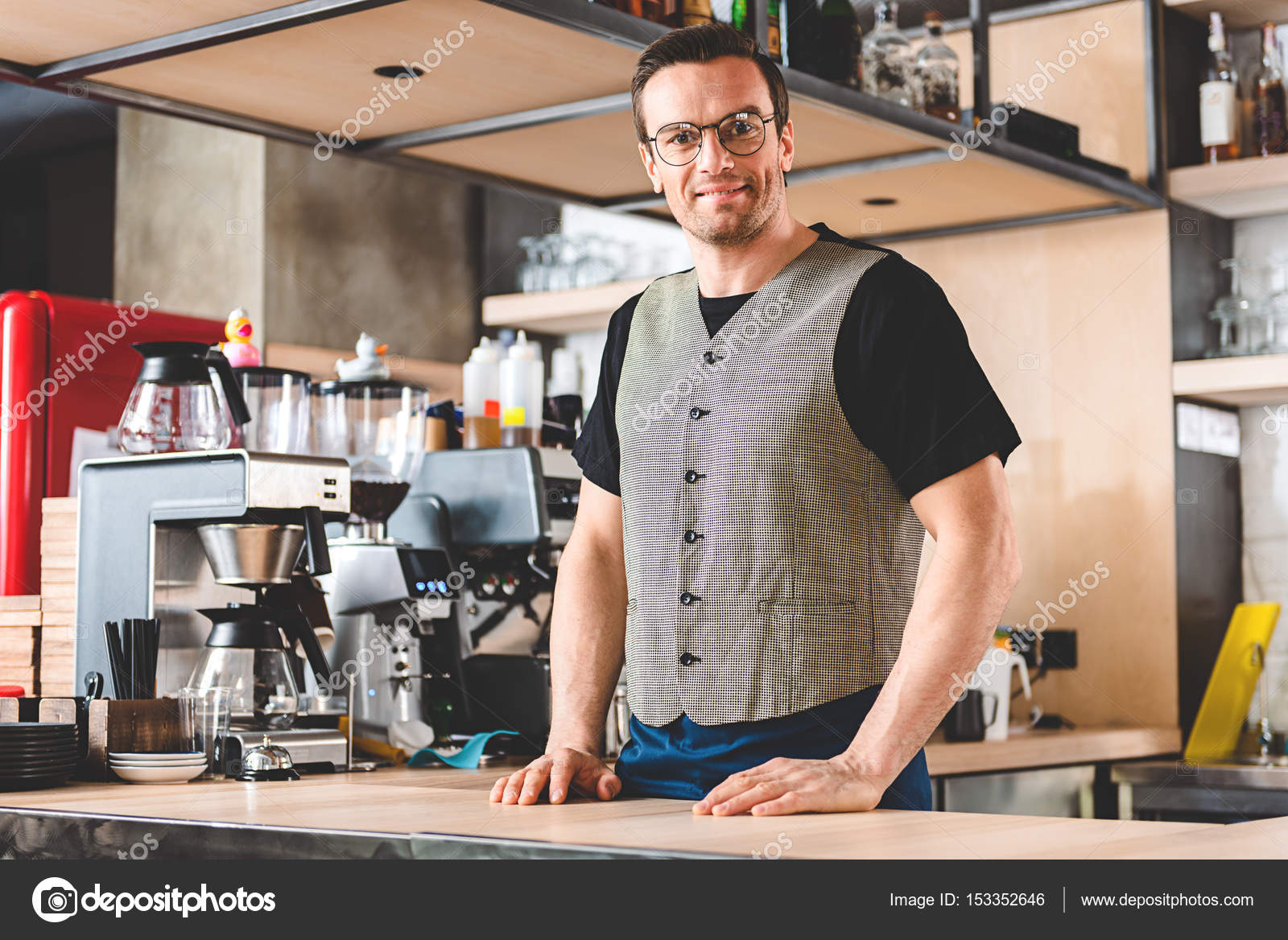 Outgoing man standing at counter in cafe Stock Photo by ©iakovenko123 ...