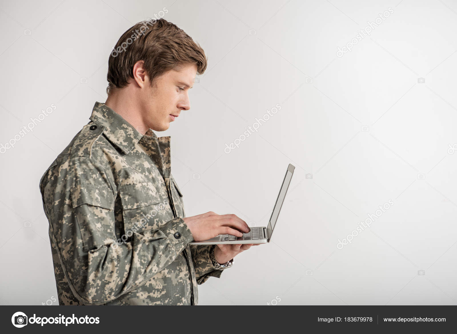 Calm military guy having laptop in hand Stock Photo by ©iakovenko123 ...