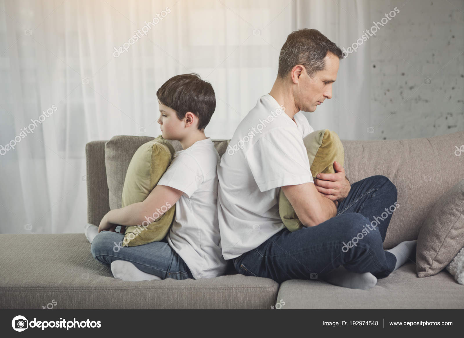 Sad parent and kid keeping resentful silence Stock Photo by ...