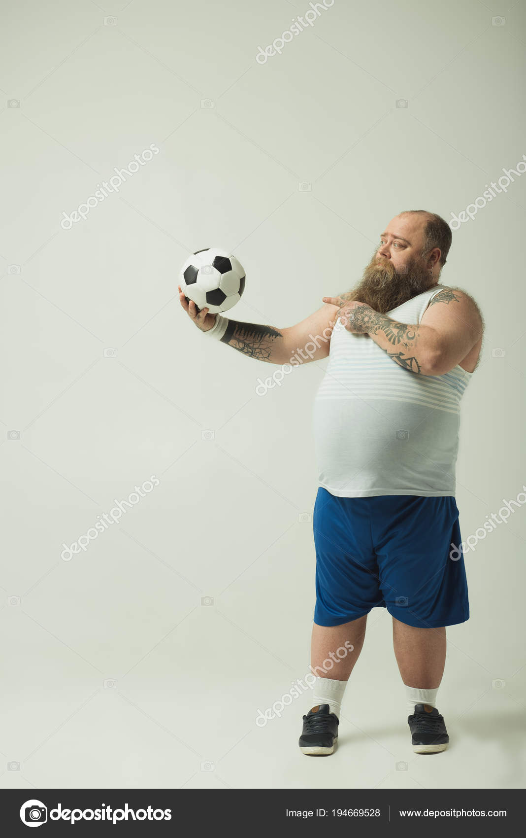 Funny fat man playing with a ball Stock Photo by ©iakovenko123 194669528