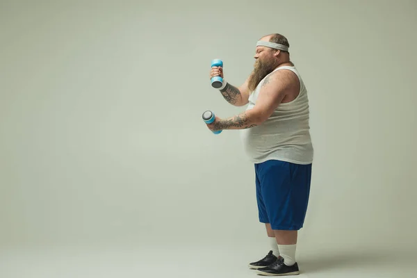 Fat man lifting weights Stock Photos, Royalty Free Fat man lifting ...