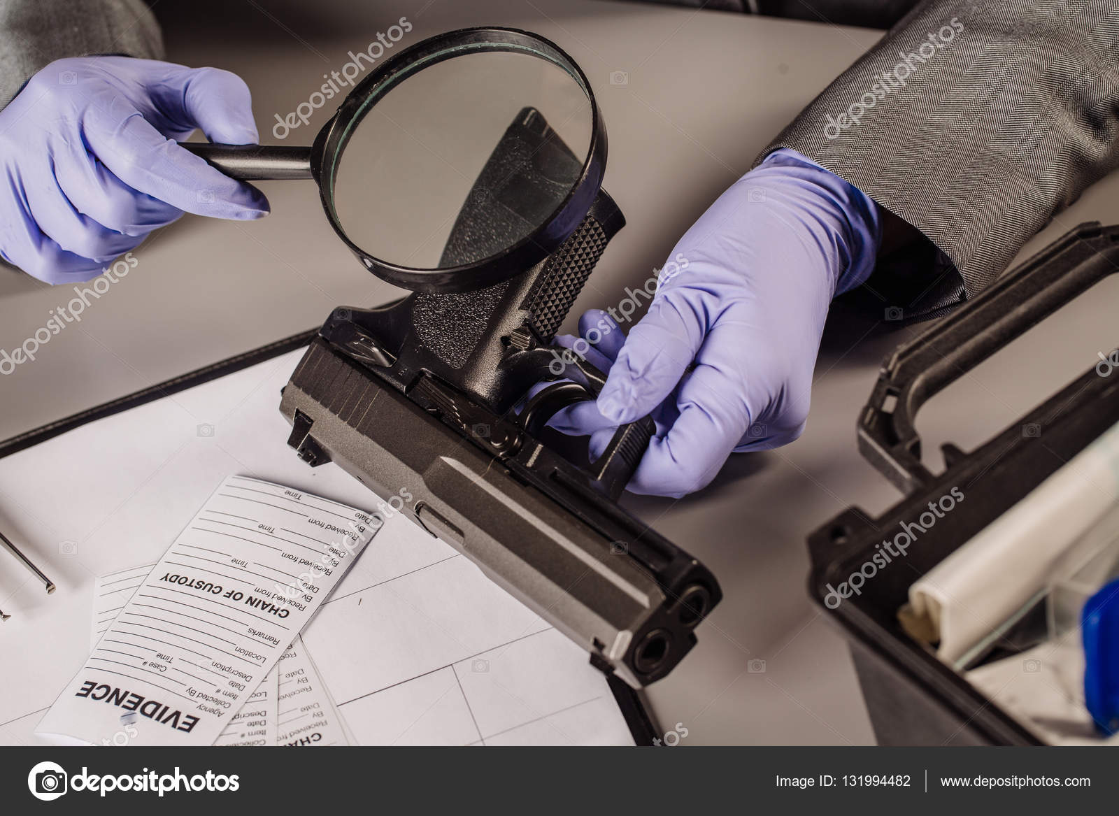 Detective through a magnifying glass looking at a evidence Stock Photo ...