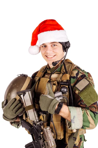 Soldier With Rifle Wearing Santa Claus Cup And Holding Cardbox I Stock