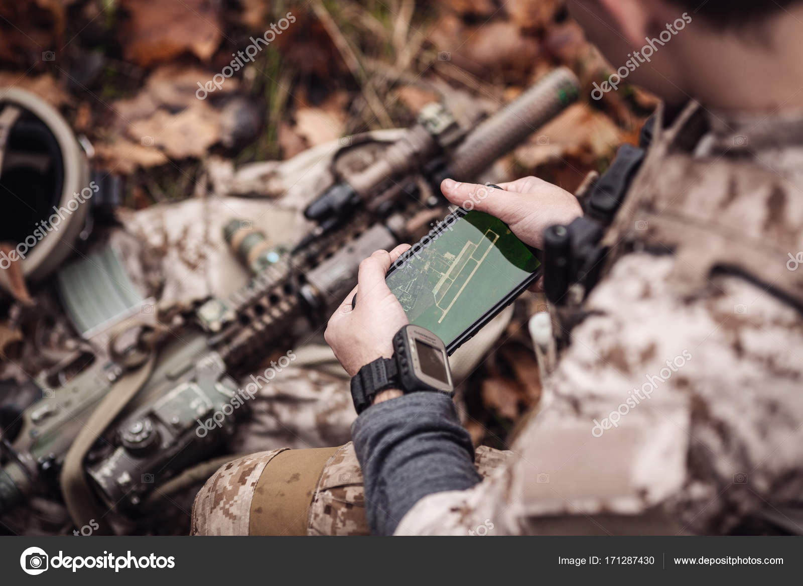 Soldiers holding gps in hand and determines the location of coor Stock ...