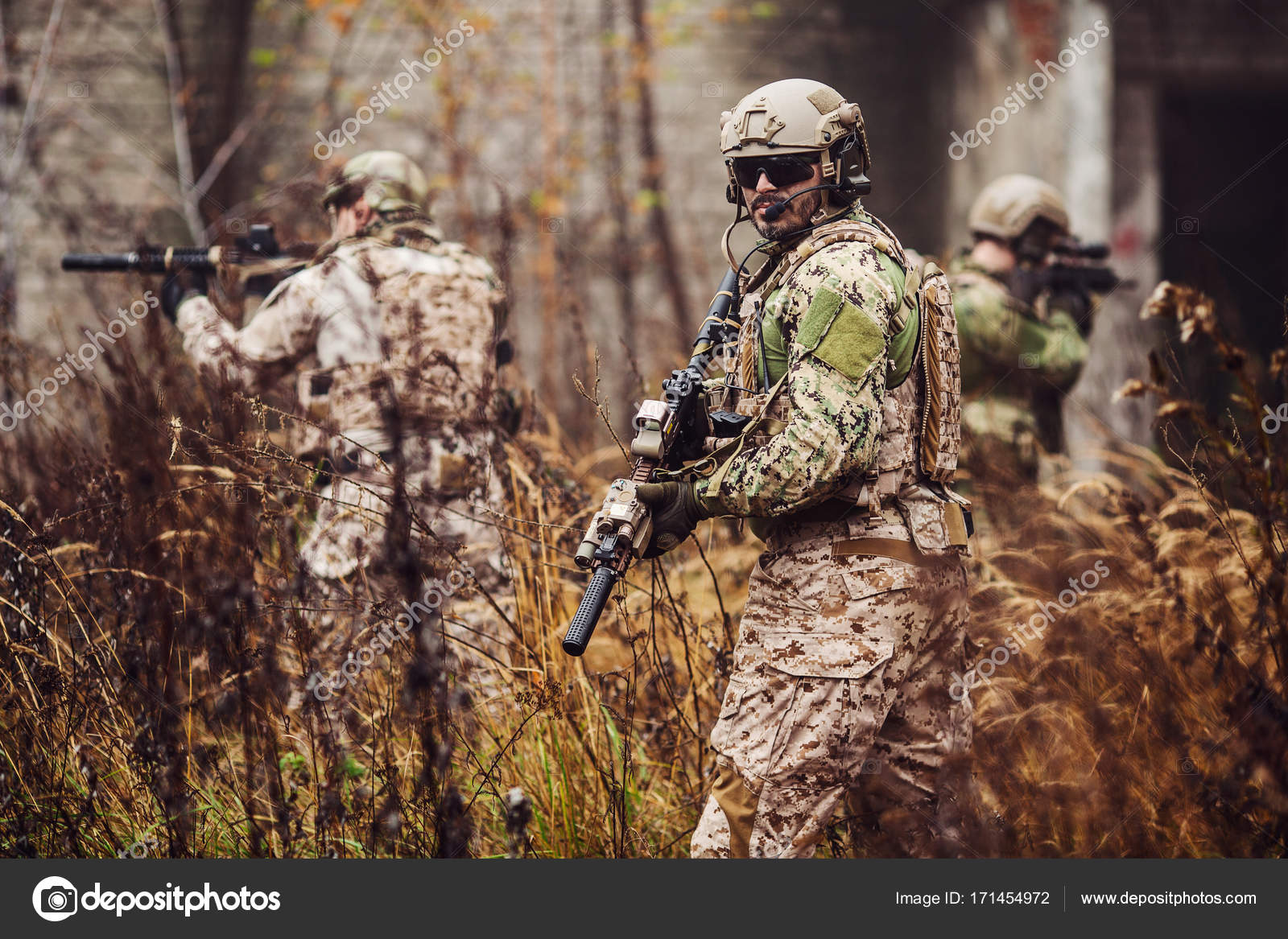 Soldier with rifle in full gear. Military man on the background Stock ...