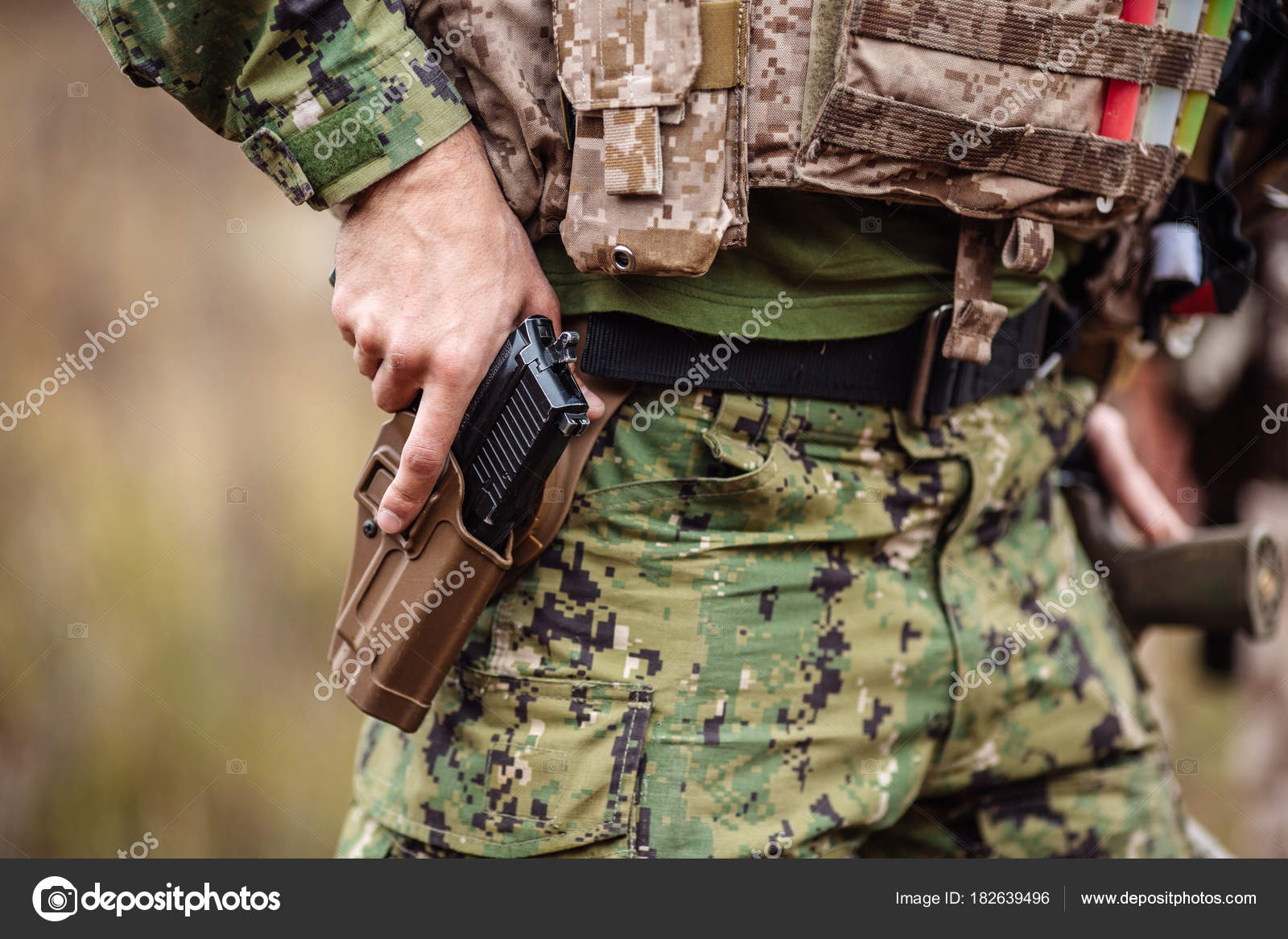 Ranger wearing uniform with gun in hand,keep gun in the holster ...