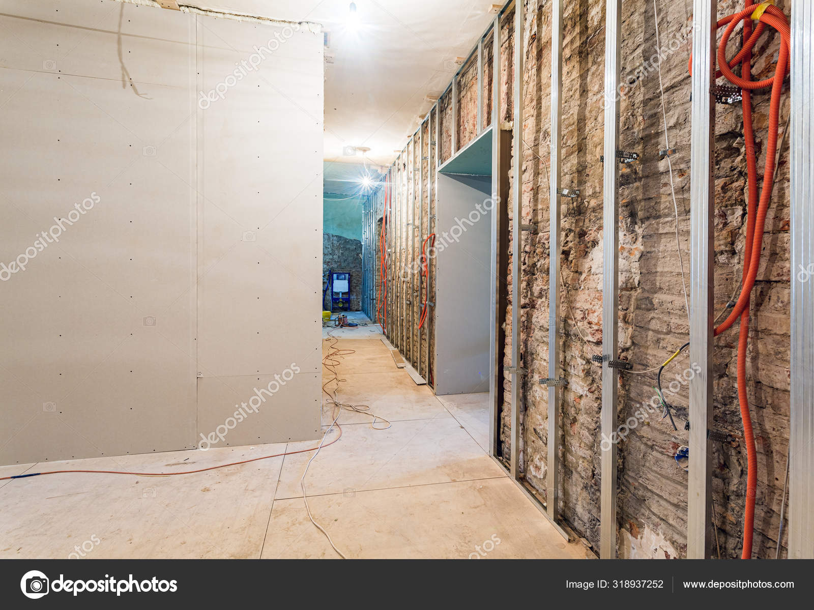 Frames for plasterboard for making gypsum walls on the brick wall in an ...