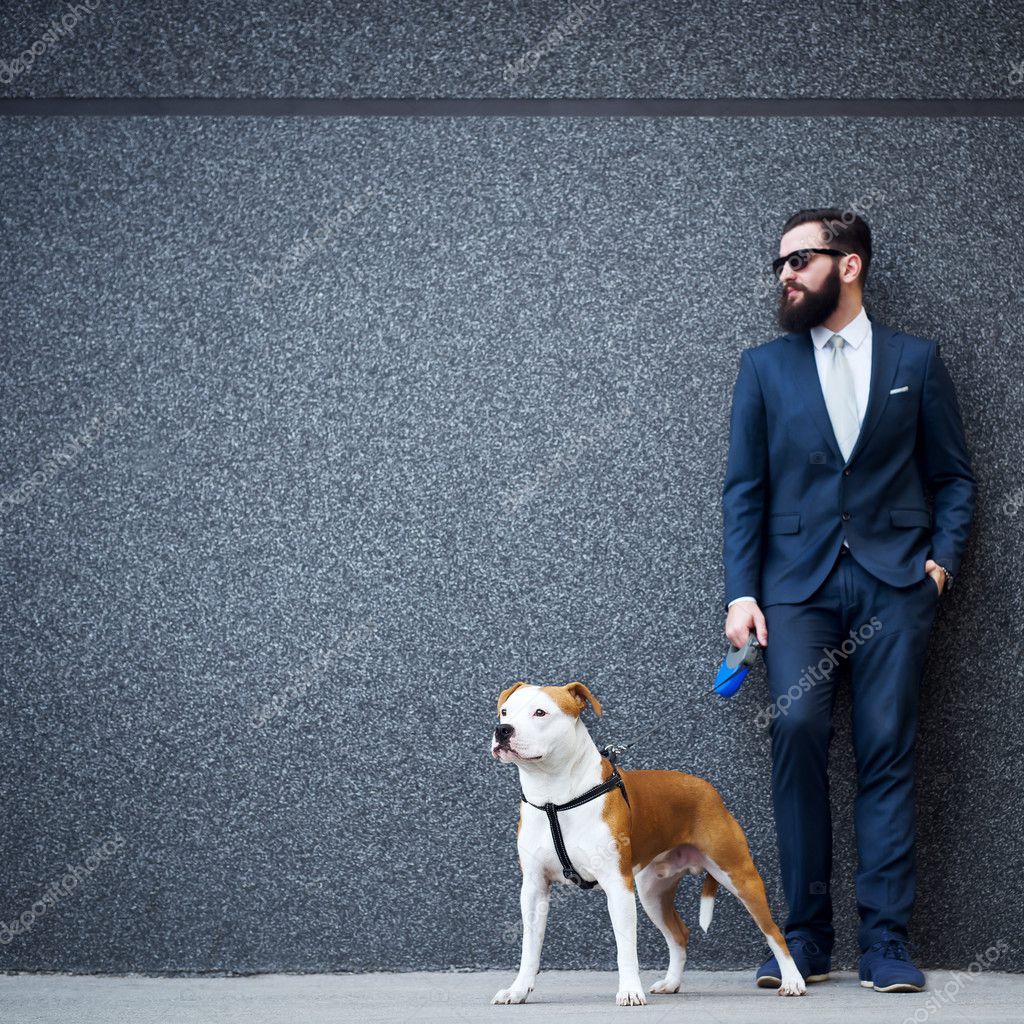Business man with his dog. — Stock Photo © dusanpetkovic #126613658