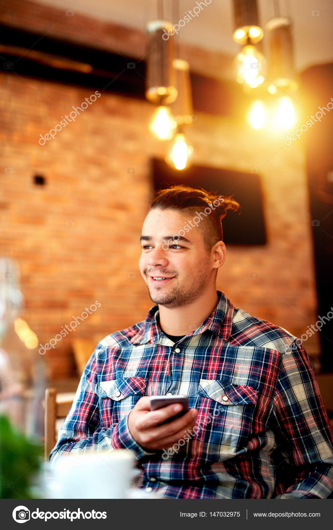 Handsome guy using smartphone — Stock Photo © dusanpetkovic #147032975