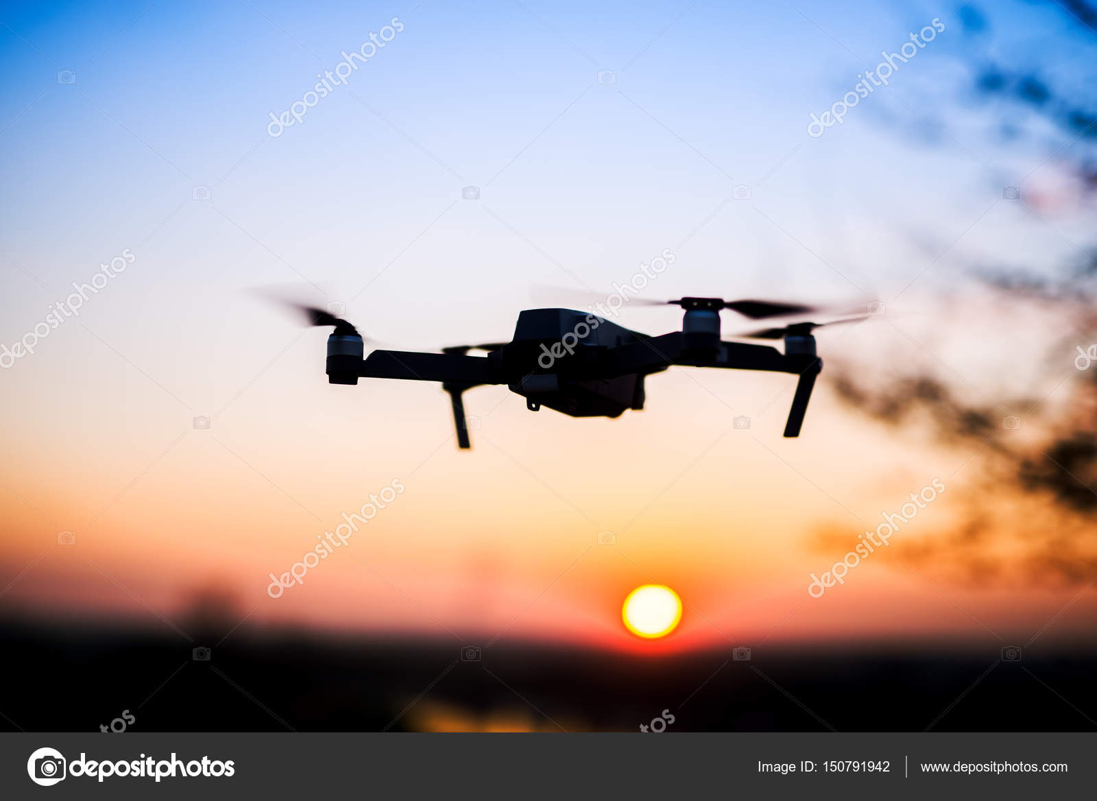 Drone flying on sunset — Stock Photo © dusanpetkovic #150791942