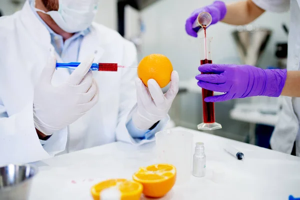 Injecting chemical substances into orange Stock Photo by ©dusanpetkovic ...