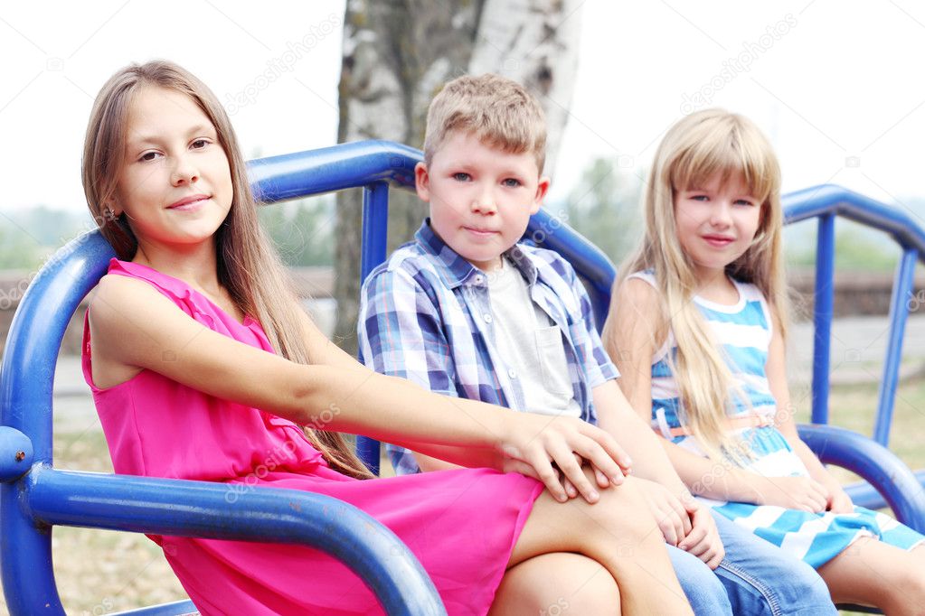 Children sitting on bench — Stock Photo © 5seconds #125866326