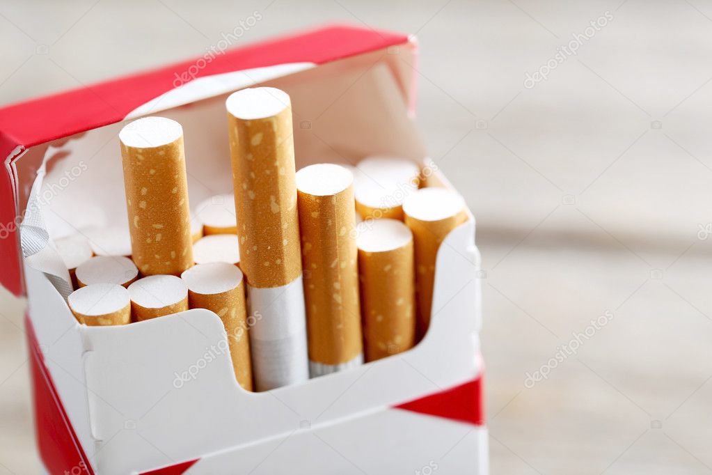 Open pack of cigarettes Stock Photo by ©5seconds 128275978