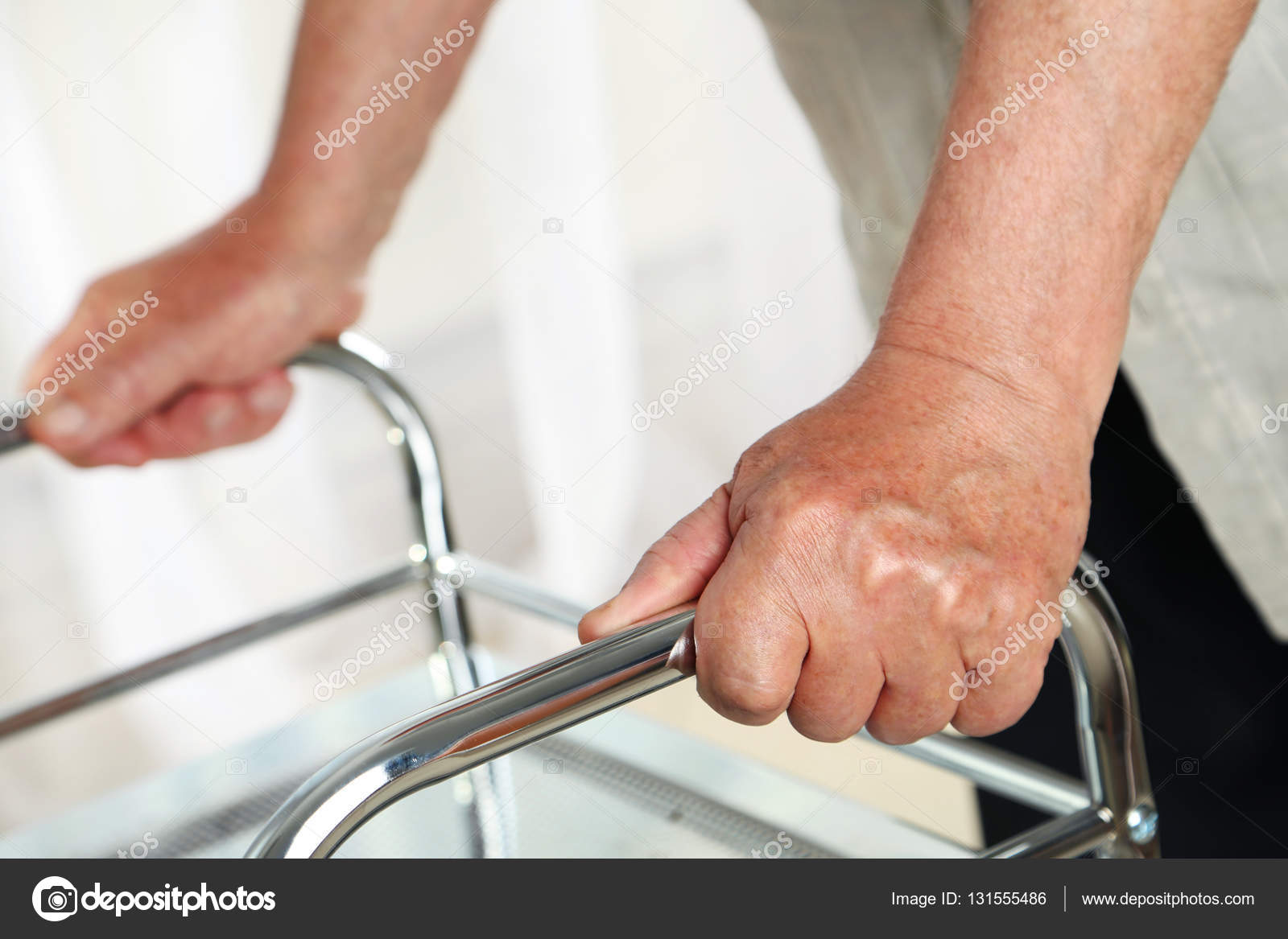 Hands holding on a walker Stock Photo by ©5seconds 131555486