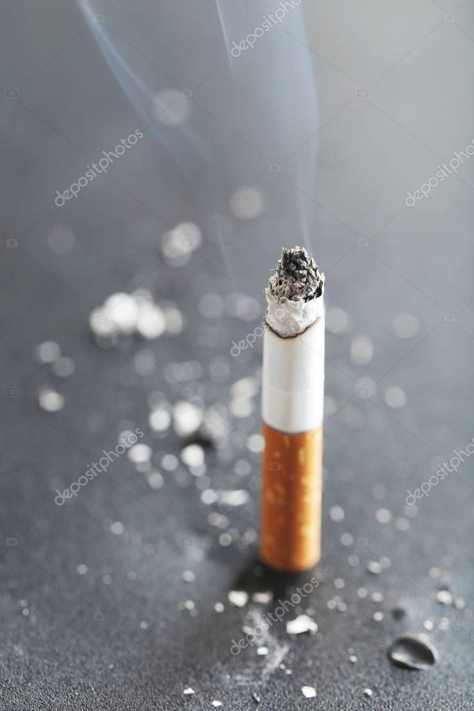 Cigarette with ash and smoke — Stock Photo © 5seconds #135124852