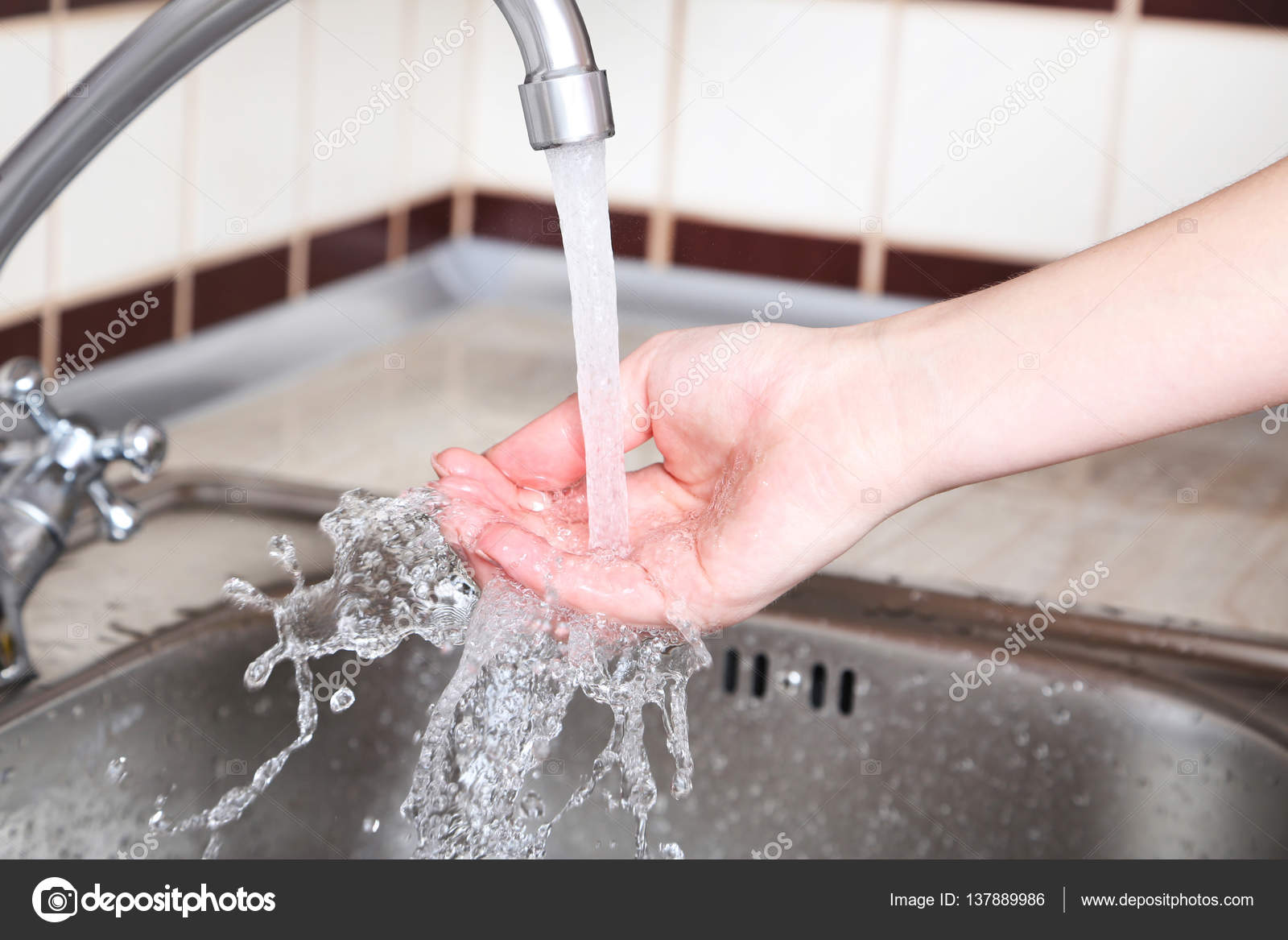 Hand Under Running Water Tap